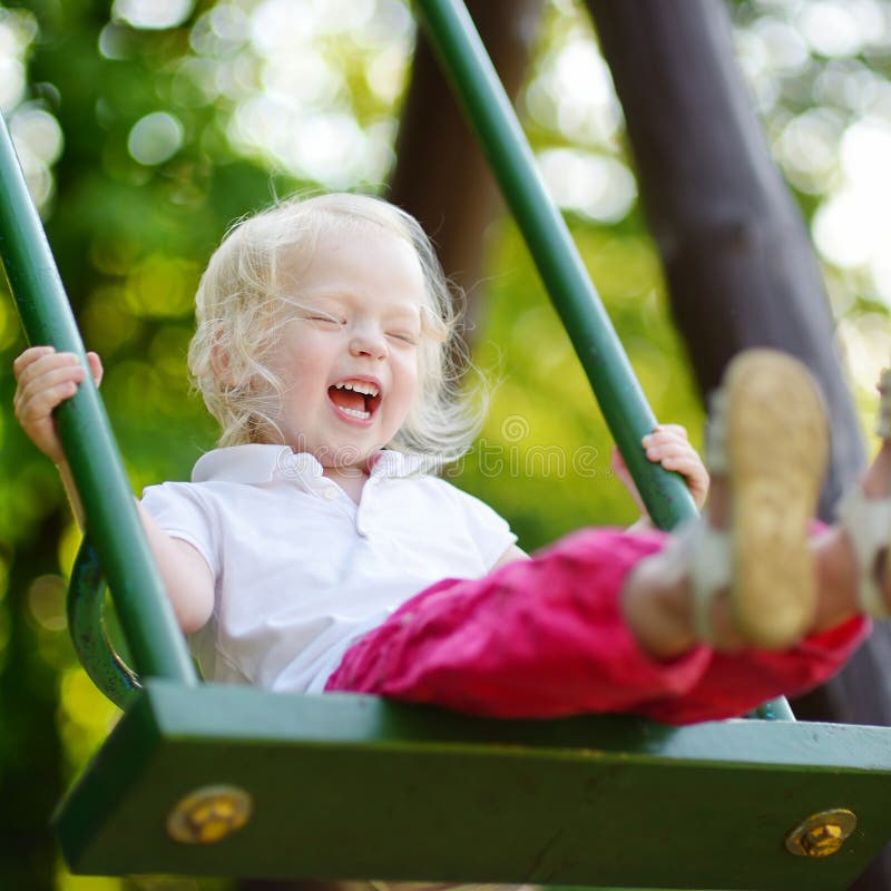 Adorable Girl Having Fun on a Swing Stock Image - Image of happy ...