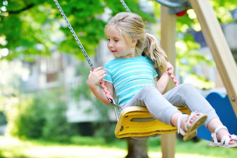 Adorable Girl Having Fun on a Swing on Summer Day Stock Photo - Image ...