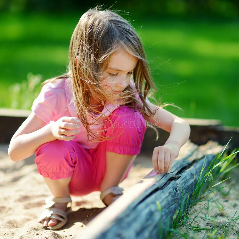 Adorable Girl Playing in a Sandbox Stock Image - Image of sandbox, girl ...
