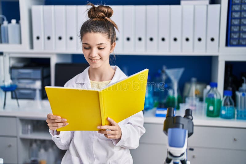 Adorable Girl Scientist Reading Book Studying at Laboratory Stock Photo ...