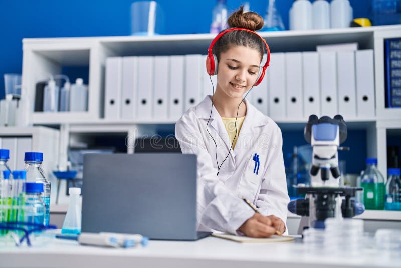 Adorable Girl Scientist Using Laptop Writing on Document at Laboratory ...