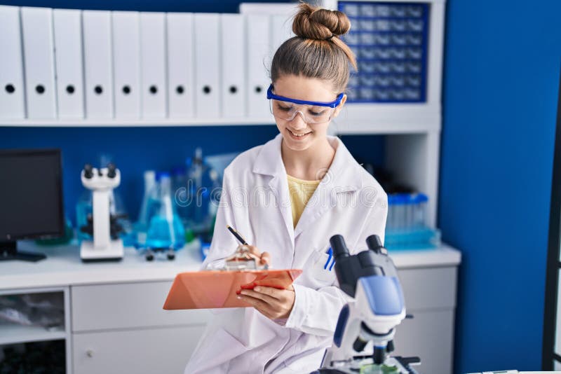 Adorable Girl Scientist Writing on Document Working at Laboratory Stock ...