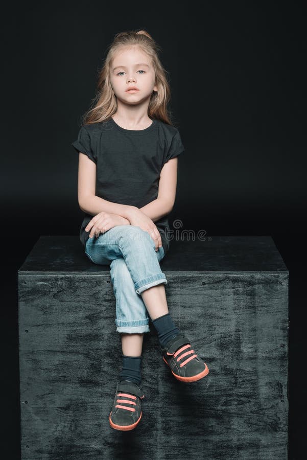 Adorable Girl Sitting and Looking at Camera Stock Image - Image of ...