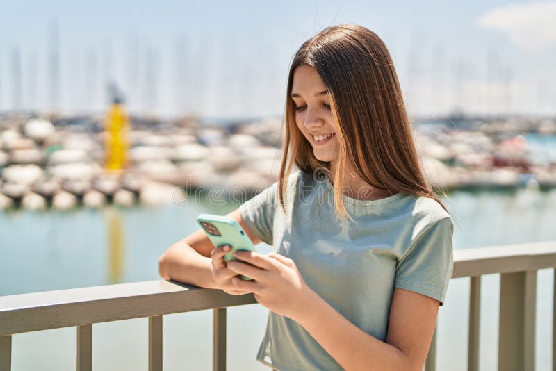 Adorable Girl Smiling Confident Using Smartphone at Seaside Stock Image ...