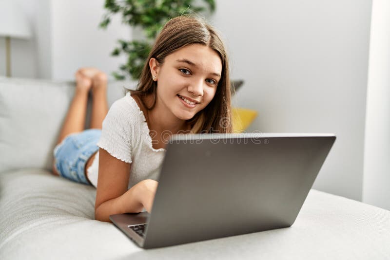Adorable Girl Using Laptop Lying on Sofa at Home Stock Photo - Image of ...