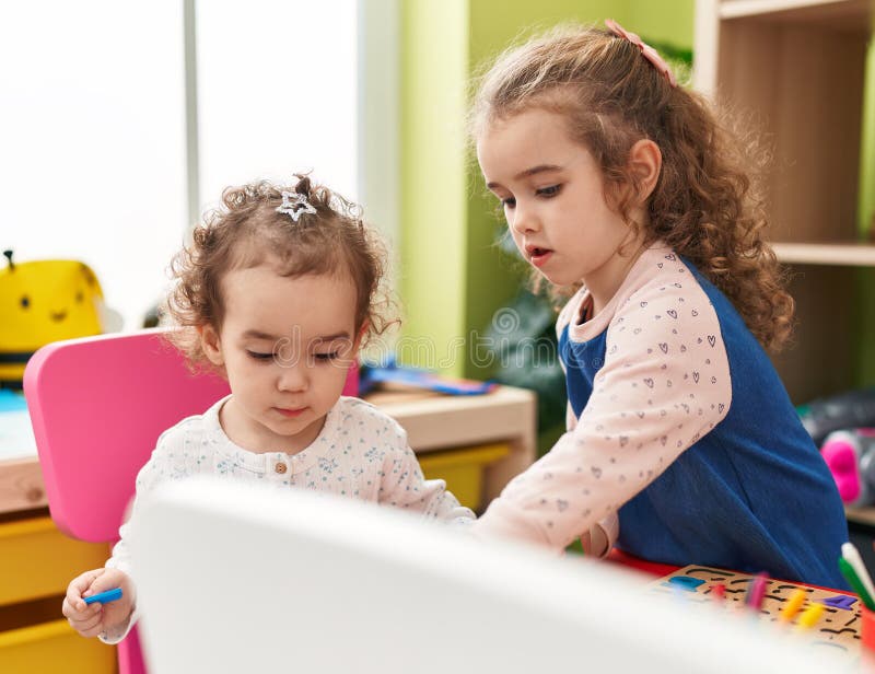 Adorable Girls Standing with Relaxed Expression Playing at Kindergarten ...