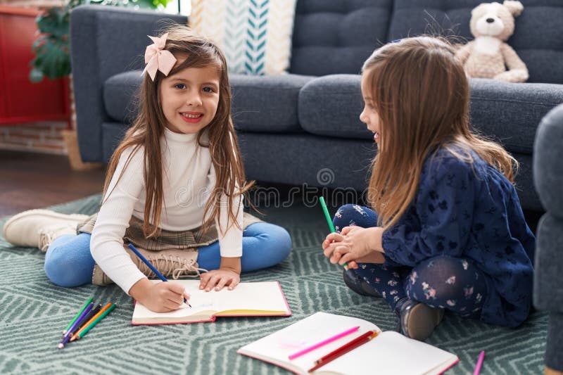 Adorable Girls Students Sitting on Floor Drawing on Notebook at Home ...