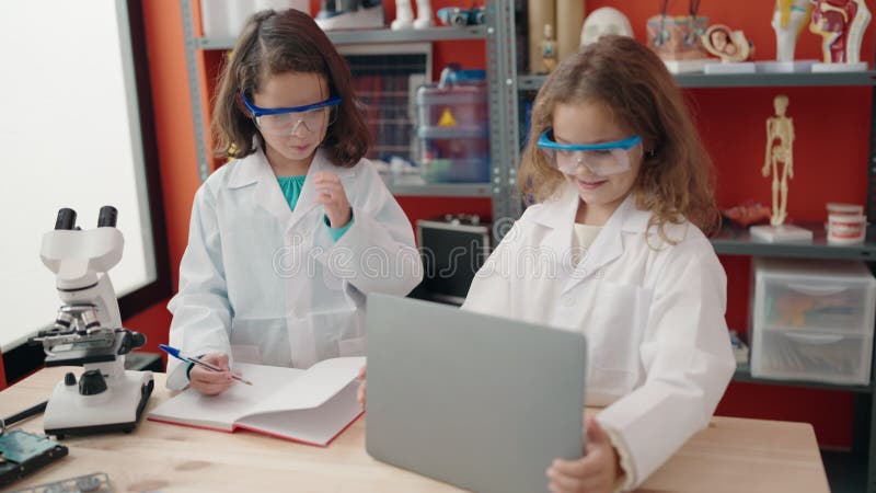 Adorable Girls Students Using Laptop Writing Notes at Laboratory ...