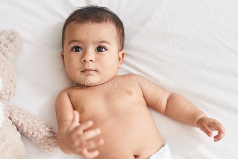 Adorable Hispanic Baby Lying on Bed at Bedroom Stock Image - Image of ...