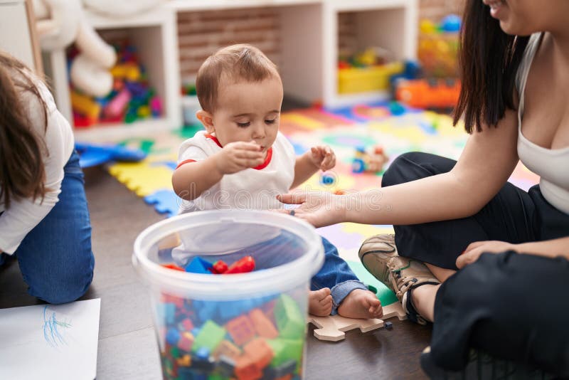 Adorable Hispanic Baby Playing with Construction Blocks Sitting on ...