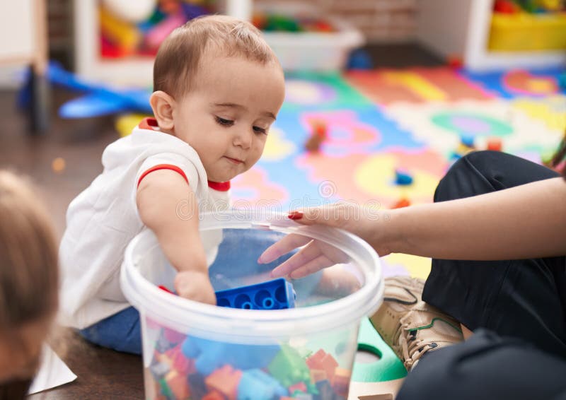 Adorable Hispanic Baby Playing with Construction Blocks Sitting on ...