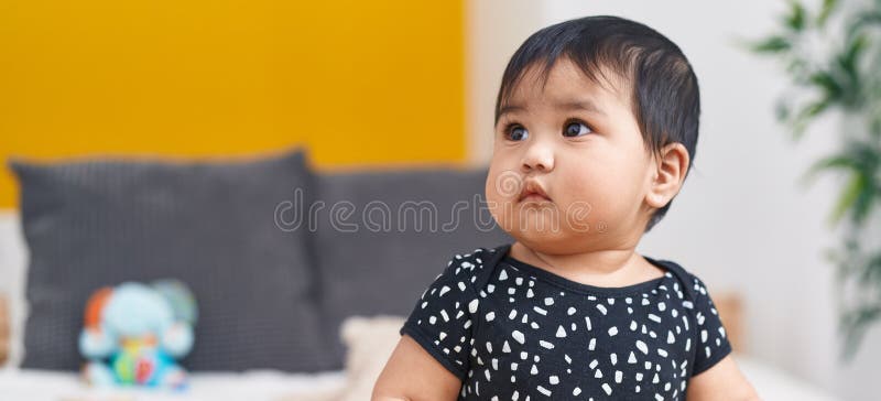 Adorable Hispanic Baby Sitting on Bed at Bedroom Stock Image - Image of ...