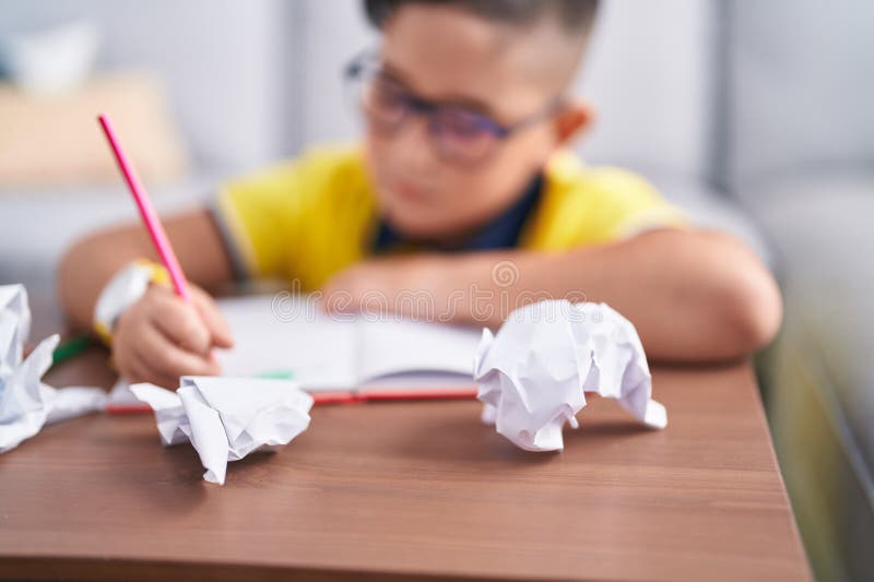 Adorable Hispanic Boy Drawing on Book Sitting on Floor at Home Stock ...