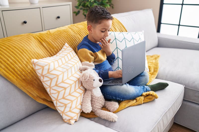 Adorable Hispanic Boy Having Video Call Sitting on Sofa at Home Stock ...