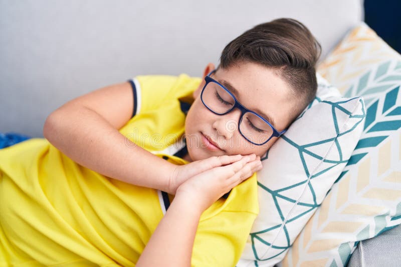 Adorable Hispanic Boy Lying on Sofa Sleeping at Home Stock Photo ...