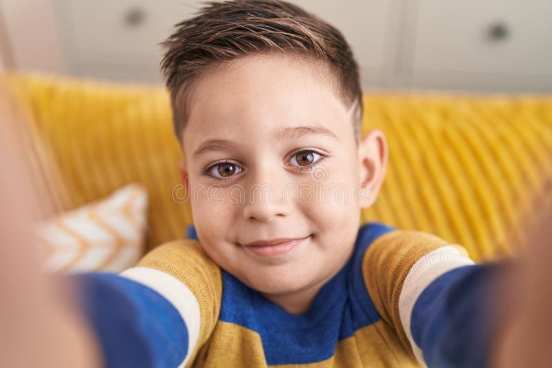 Adorable Hispanic Boy Make Selfie by Camera Sitting on Sofa at Home ...