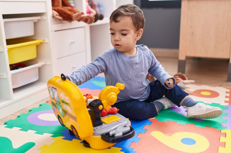 Adorable Hispanic Boy Playing with Tools Toy Sitting on Floor at ...