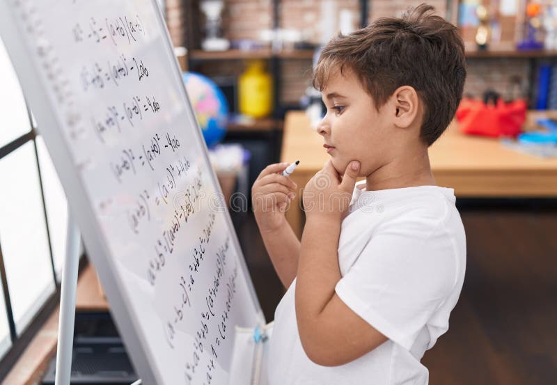 Adorable Hispanic Boy Preschool Student Writing on Chalkboard at ...
