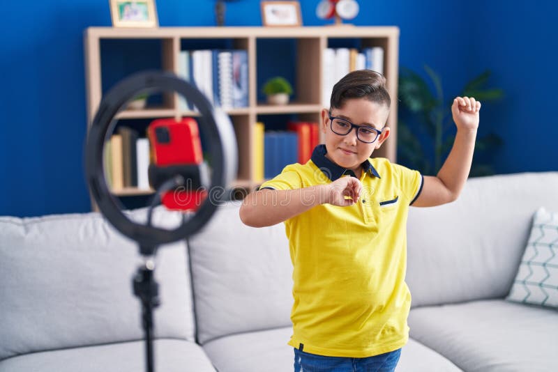 Adorable Hispanic Boy Recording Video Dancing at Home Stock Image ...