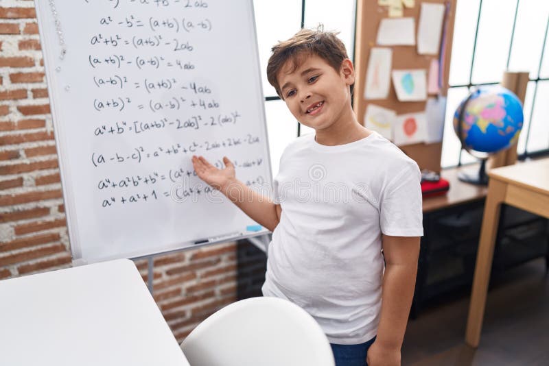 Adorable Hispanic Boy Smiling Confident Standing by Chalkboard with ...
