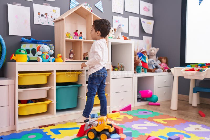 Adorable Hispanic Boy Standing on Back View Playing at Kindergarten ...