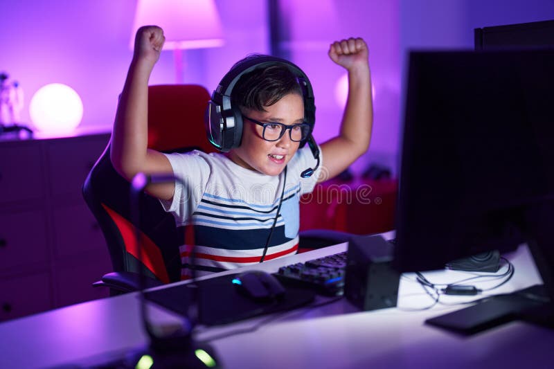 Adorable Hispanic Boy Streamer Playing Video Game with Winner ...