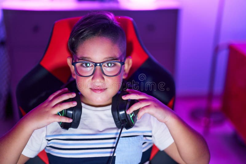 Adorable Hispanic Boy Streamer Smiling Confident Sitting on Table at ...
