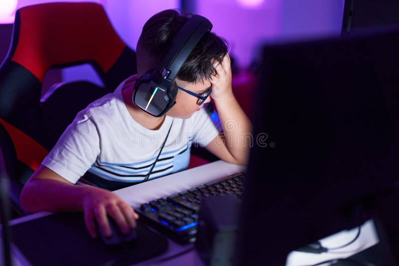 Adorable Hispanic Boy Streamer Stressed Using Computer at Gaming Room ...