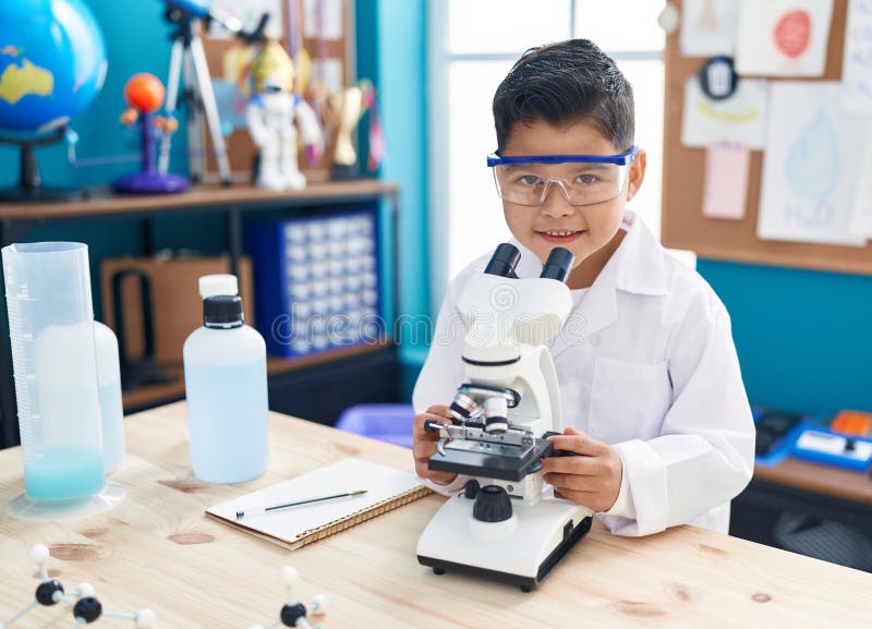 Adorable Hispanic Boy Student Smiling Confident Using Microscope at ...