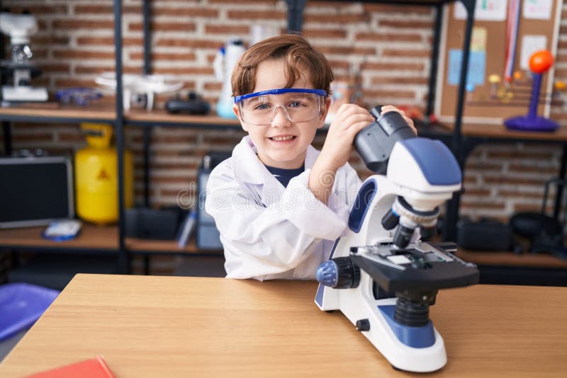 Adorable Hispanic Boy Student Smiling Confident Using Microscope at ...