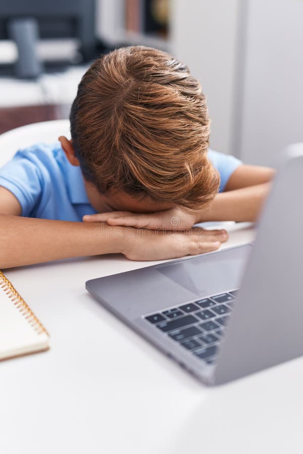 Adorable Hispanic Boy Student Using Computer with Stressed Expression ...