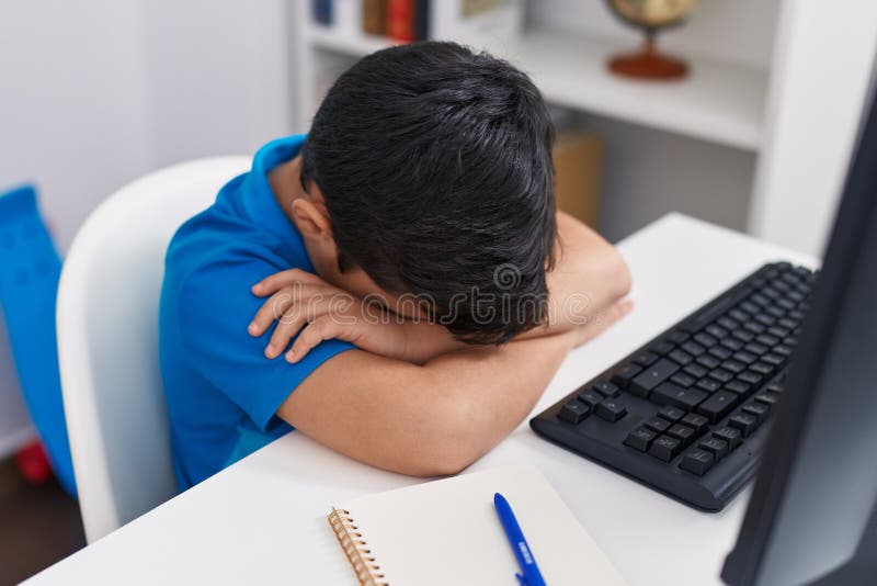 Adorable Hispanic Boy Student Using Computer with Stressed Expression ...