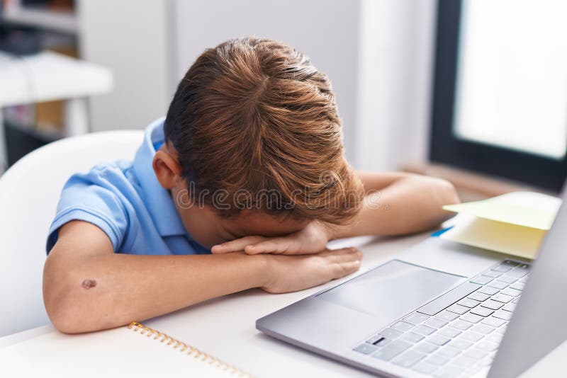 Adorable Hispanic Boy Student Using Computer with Stressed Expression ...