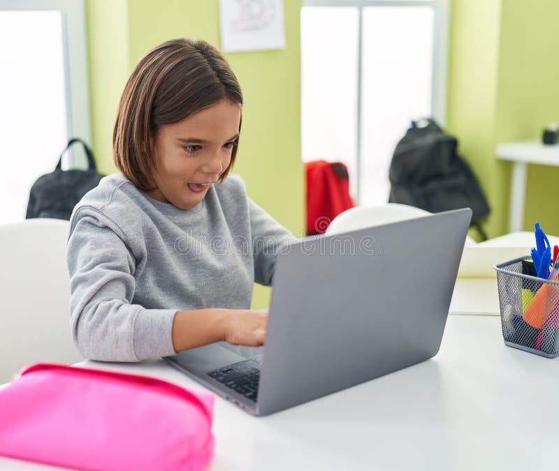 Adorable Hispanic Boy Student Using Laptop Sitting on Table at ...