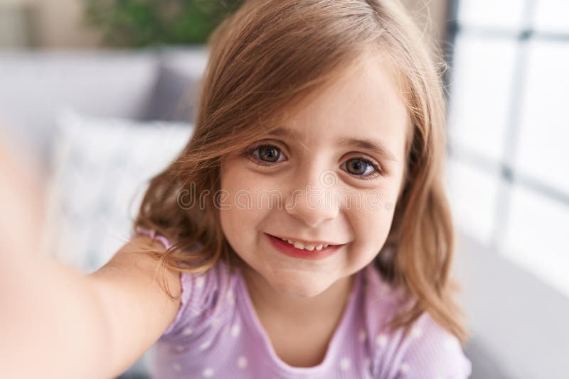 Adorable Hispanic Girl Make Selfie by Camera Sitting on Sofa at Home ...