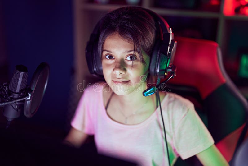 Adorable Hispanic Girl Streamer Playing Video Game Using Computer at ...