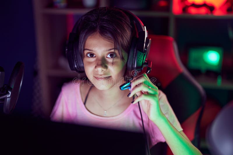 Adorable Hispanic Girl Streamer Playing Video Game Using Computer at ...