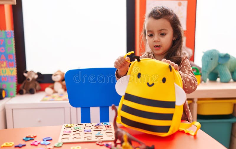 Adorable Hispanic Girl Student Opening Backpack Standing at ...