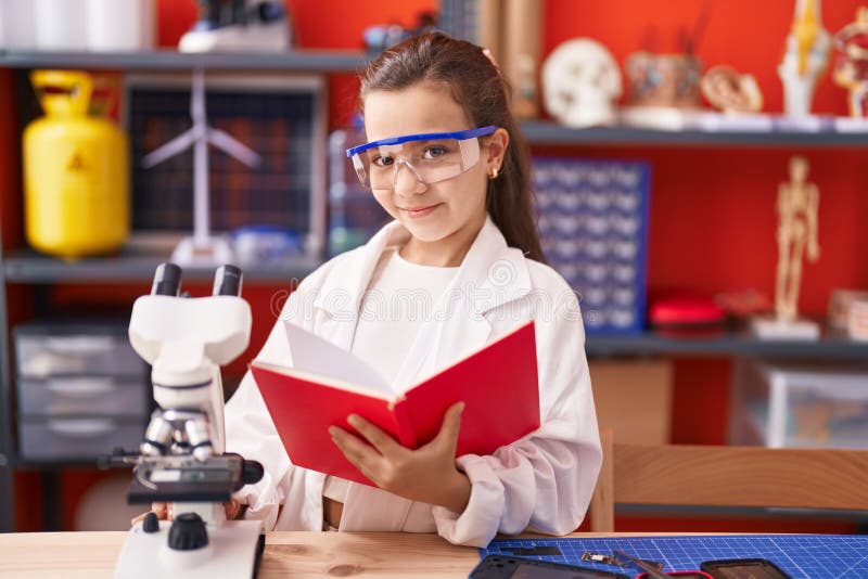 Adorable Hispanic Girl Student Smiling Confident Reading Book at ...