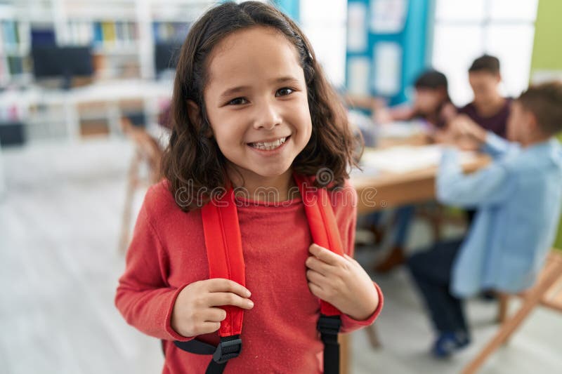Adorable Hispanic Girl Student Smiling Confident Standing at Classroom ...