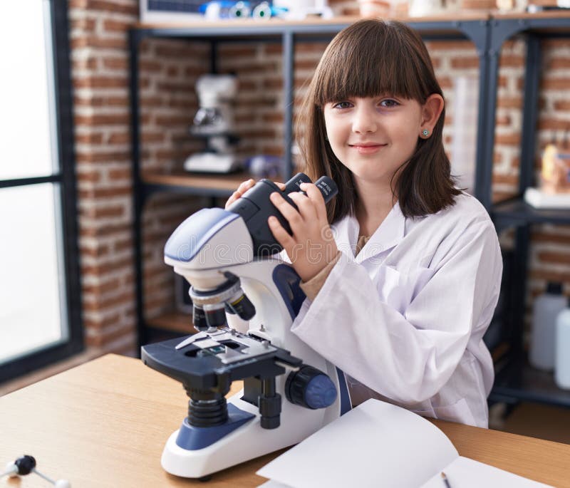 Adorable Hispanic Girl Student Smiling Confident Using Microscope at ...