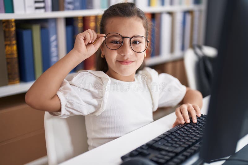 Adorable Hispanic Girl Student Using Computer Sitting on Table at ...