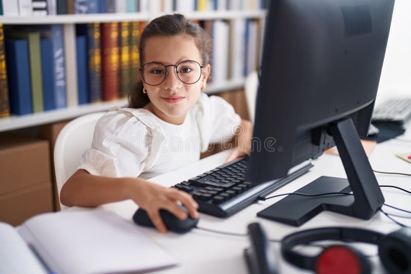 Adorable Hispanic Girl Student Using Computer Sitting on Table at ...