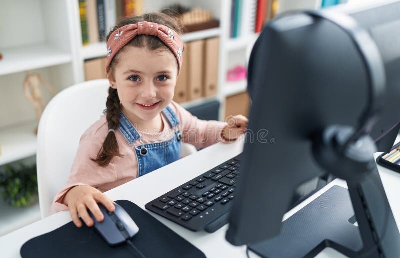 Adorable Hispanic Girl Student Using Computer Sitting on Table at ...