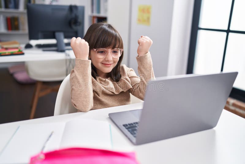 Adorable Hispanic Girl Student Using Laptop with Celebration Expression ...