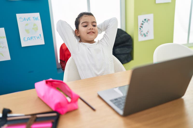 Adorable Hispanic Girl Student Using Laptop Relaxed with Hands on Head ...
