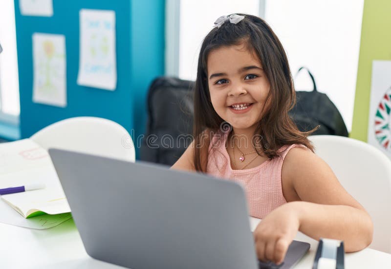 Adorable Hispanic Girl Student Using Laptop Sitting on Table at ...