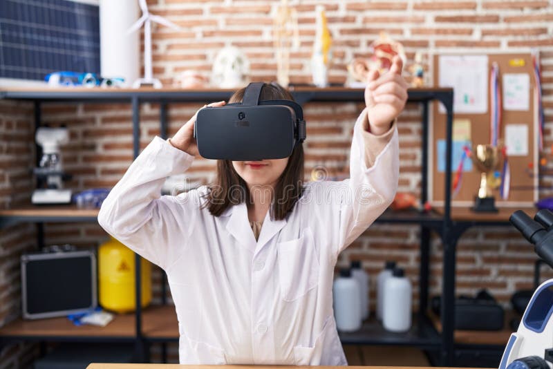 Adorable Hispanic Girl Student Using Virtual Reality Glasses at ... Adorable Hispanic Girl Student Using Virtual Reality Glasses at ...