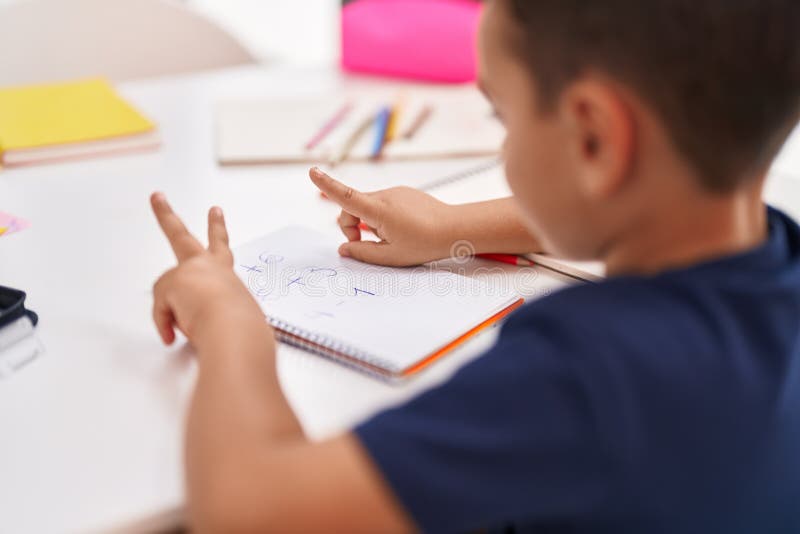 Adorable Hispanic Toddler Doing Mathematics Exercise Counting with ...