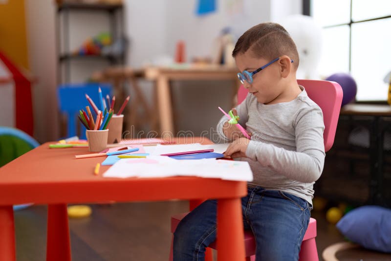 Adorable Hispanic Toddler Student Cutting Paper at Classroom Stock ...